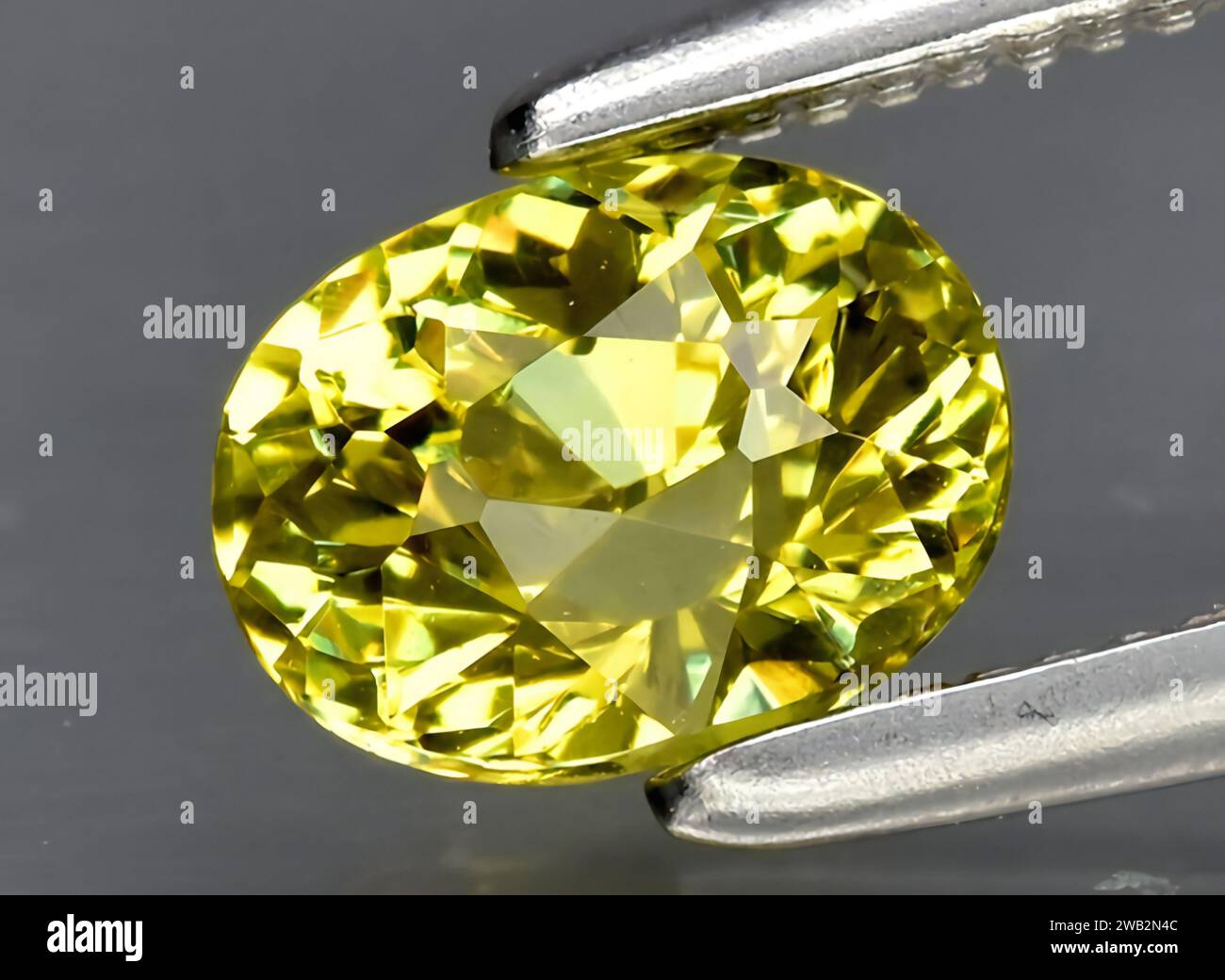 Natural yellow grossular garnet gem on background Stock Photo - Alamy