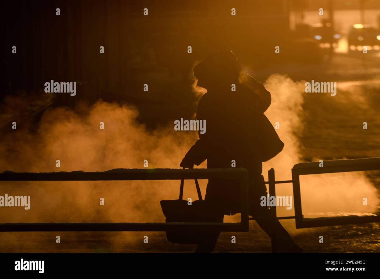 RIGA, Latvia. 8th Jan, 2024. Selective focus photo. Person walks on ...