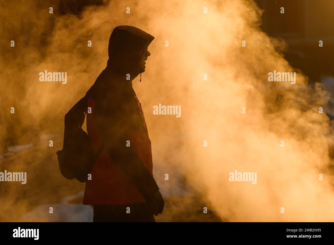 RIGA, Latvia. 8th Jan, 2024. Selective focus photo. Person walks on ...