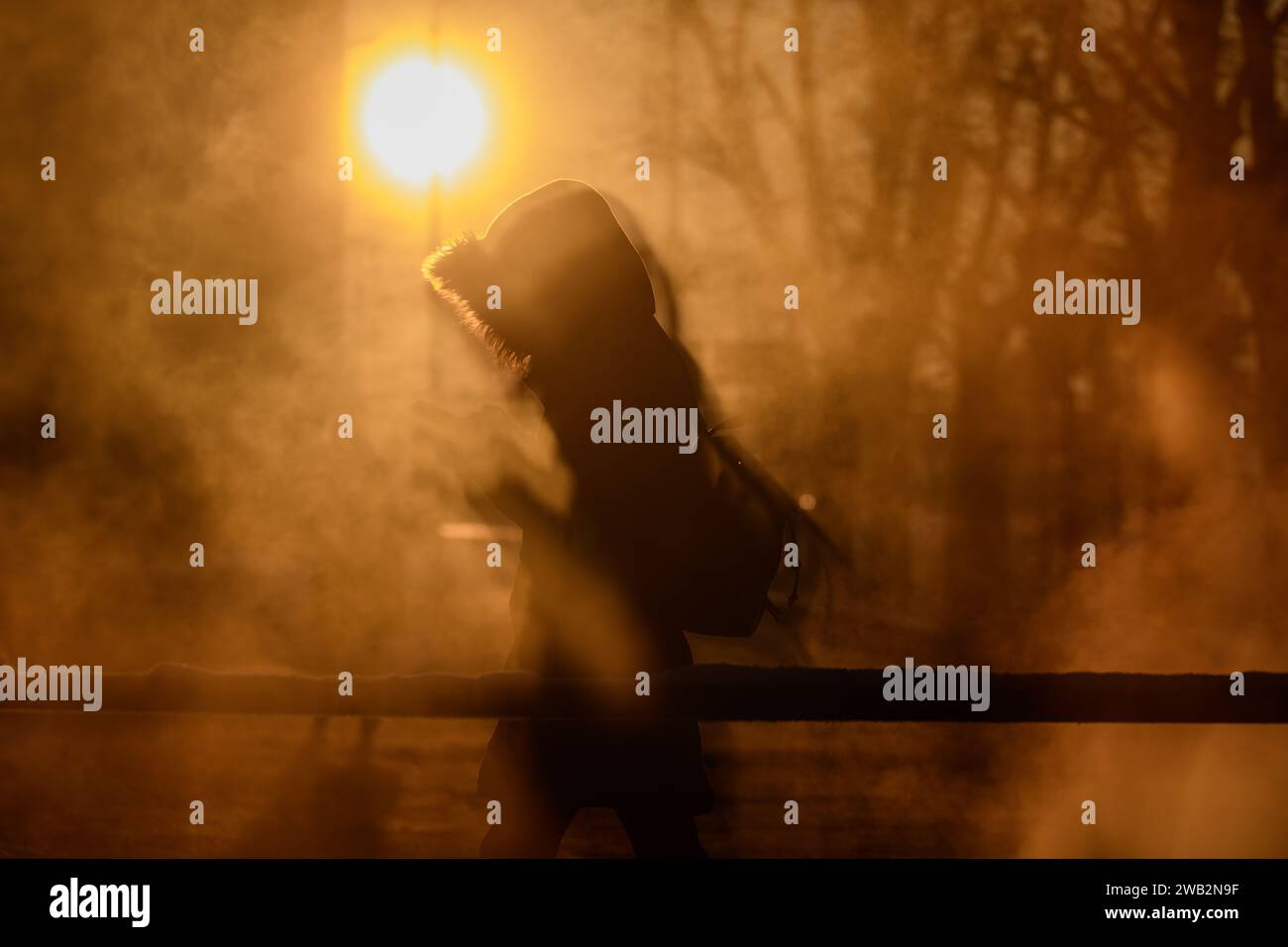 RIGA, Latvia. 8th Jan, 2024. Selective focus photo. Person walks on ...