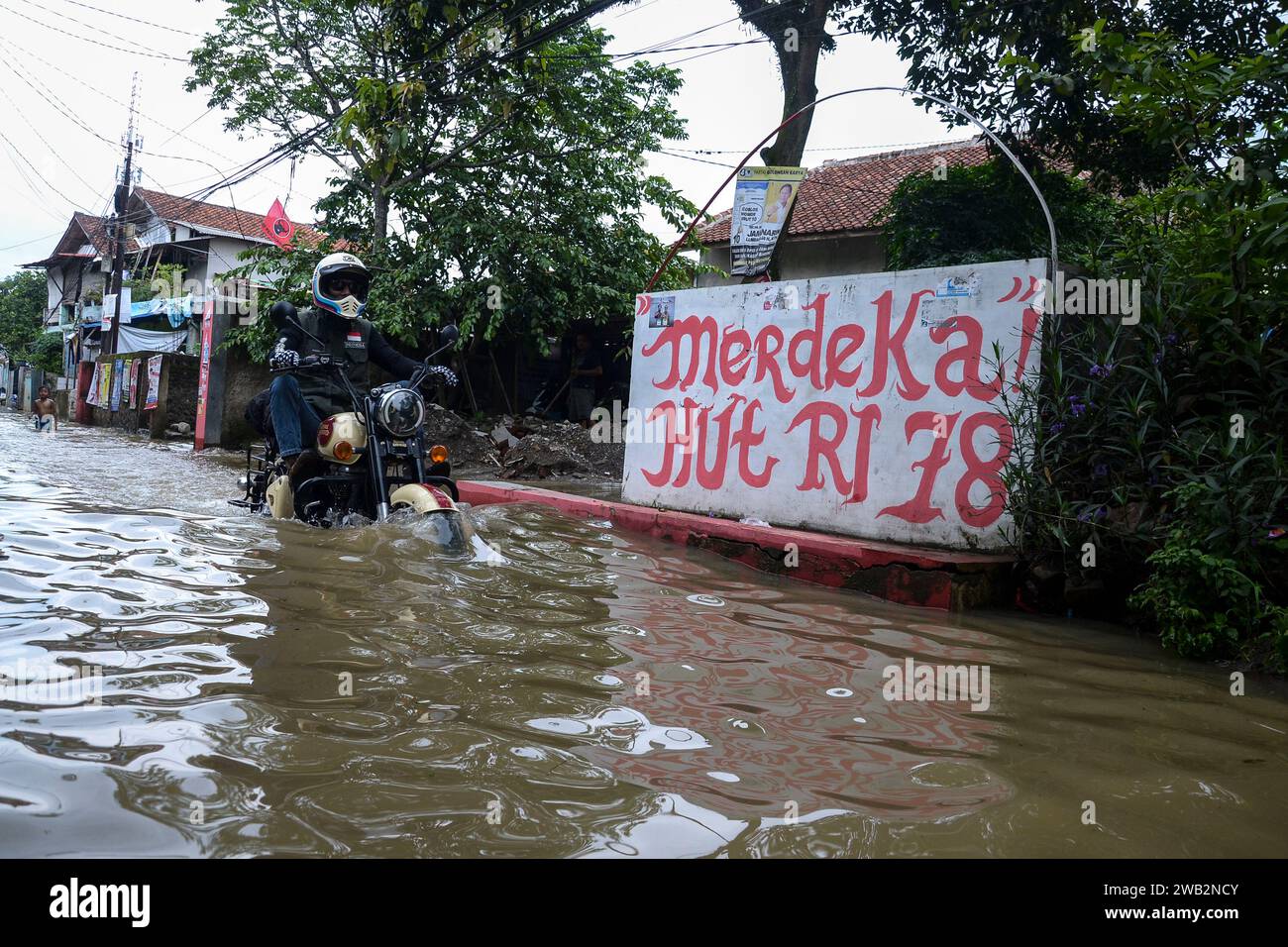 Bandung Regency, West Java, Indonesia. 8th Jan, 2024. A resident passes ...