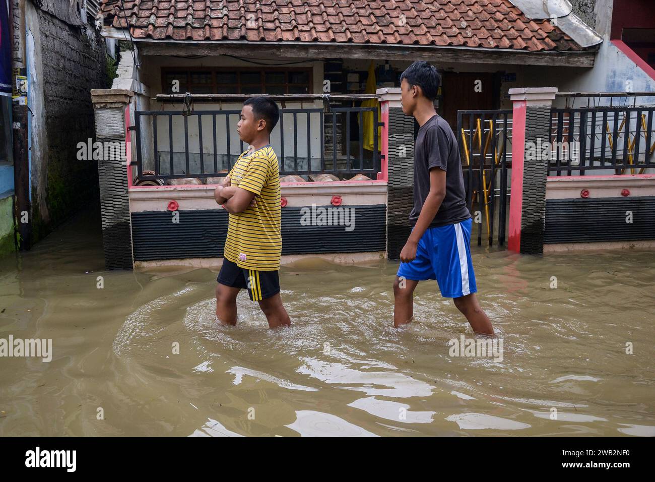 Bandung Regency, West Java, Indonesia. 8th Jan, 2024. Residents pass ...
