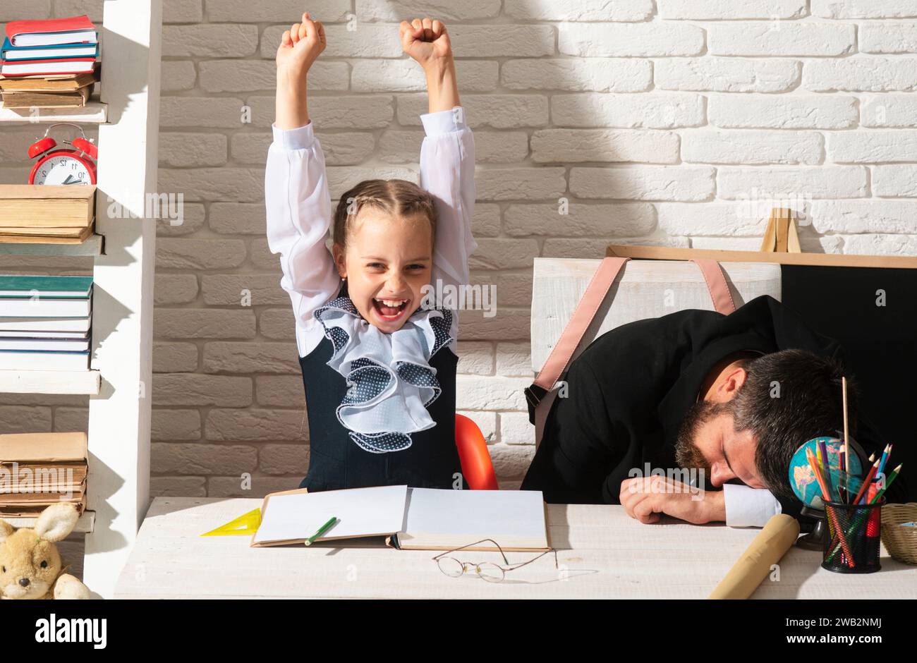 Tired teacher and excited pupil school girl. Stressed work in school ...