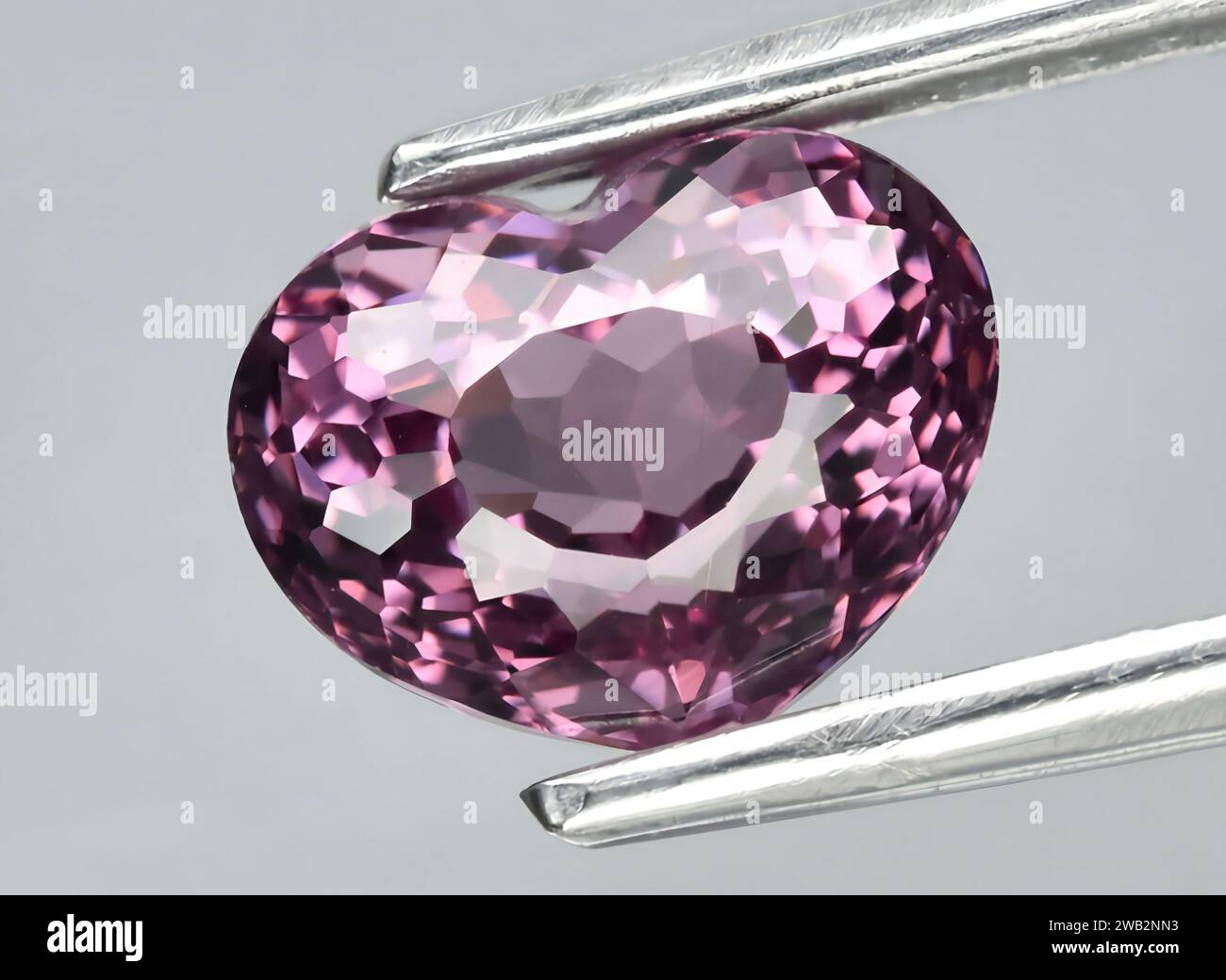 Natural pink malaya garnet gem background Stock Photo - Alamy