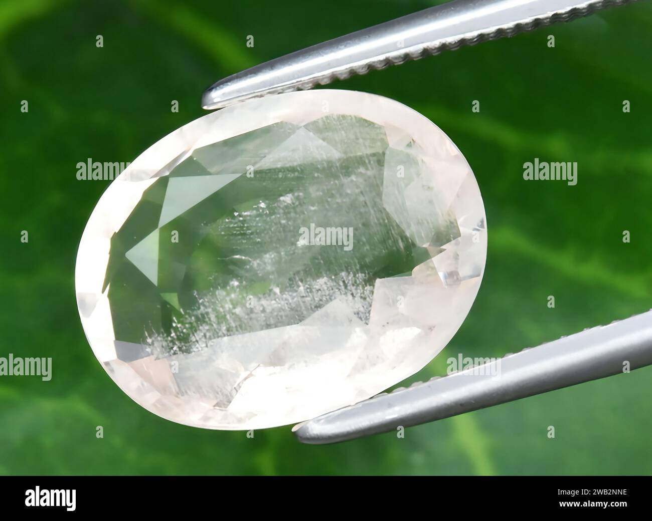 Natural peach morganite beryl gem on background Stock Photo - Alamy