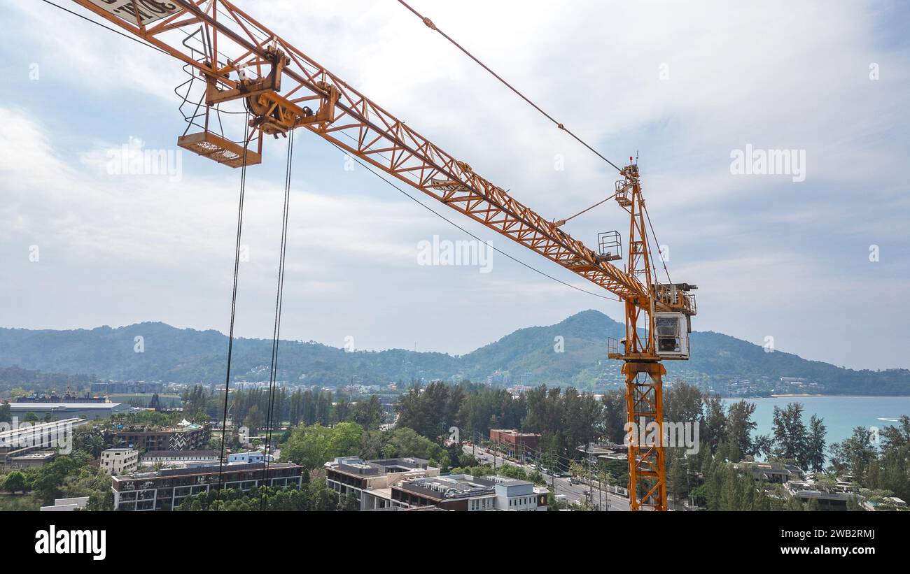 Close-up view from a drone of a construction crane cabin against the ...