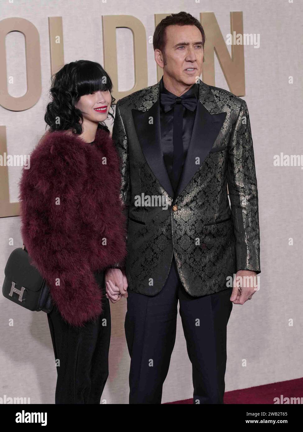 Los Angeles, USA. 07th Jan, 2024. Rico Shibata and Nicolas Cage attend ...