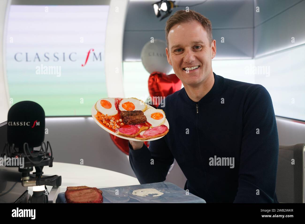 Radio presenter Dan Walker is given a celebratory cake in the shape of ...