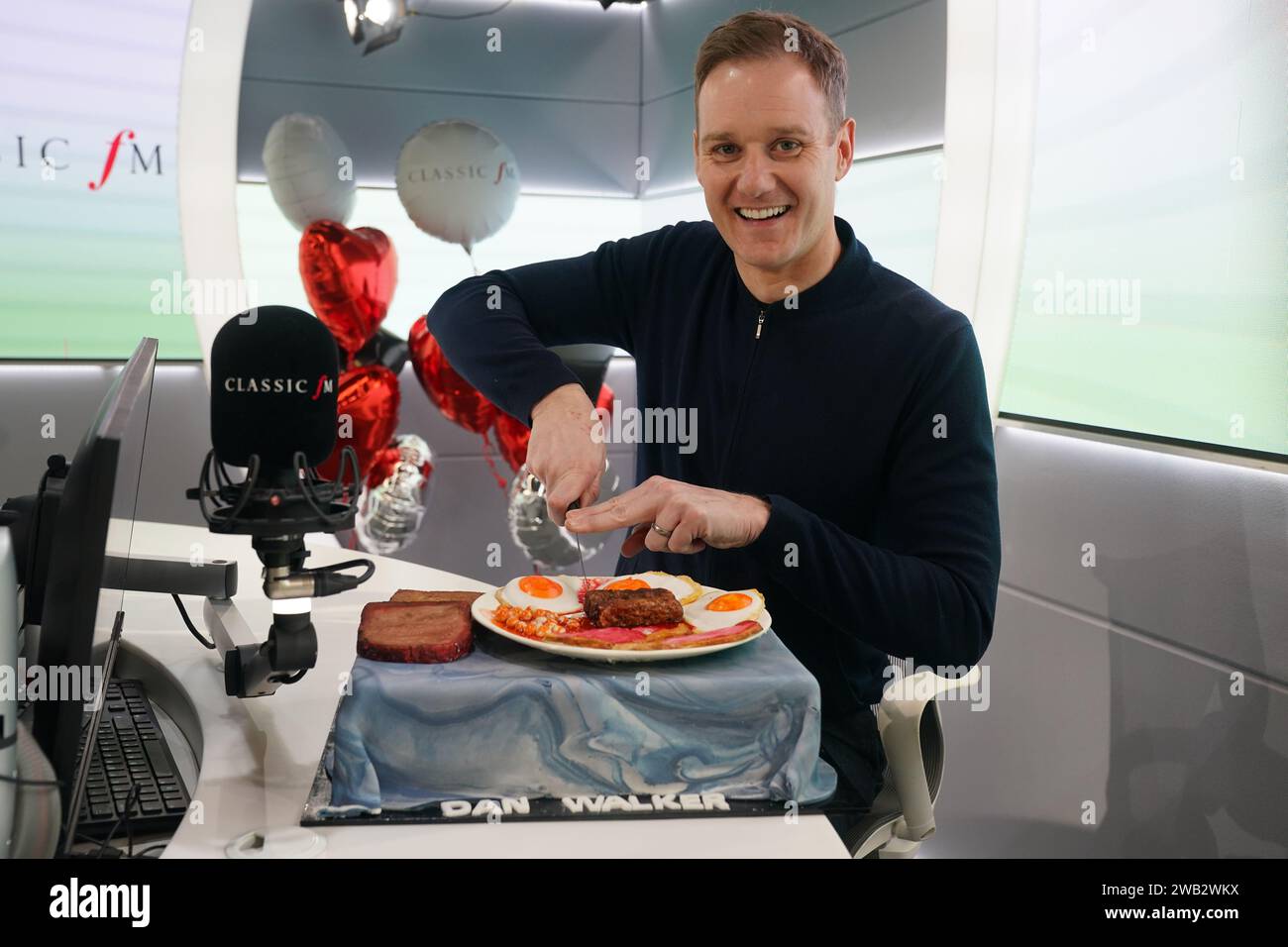 Radio presenter Dan Walker is given a celebratory cake in the shape of ...