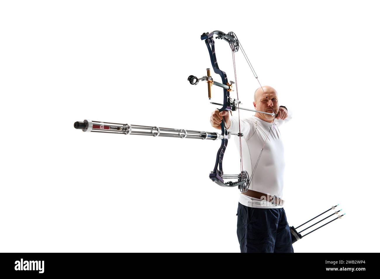 Man in his 40s, archery athlete with bow and arrow aiming at archery ...