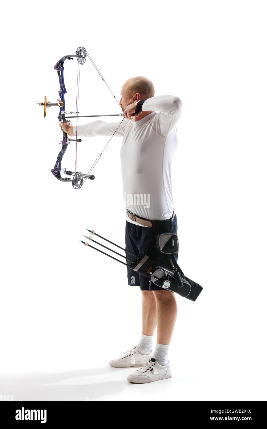 Concentrated man, archery athlete with special equipment training ...