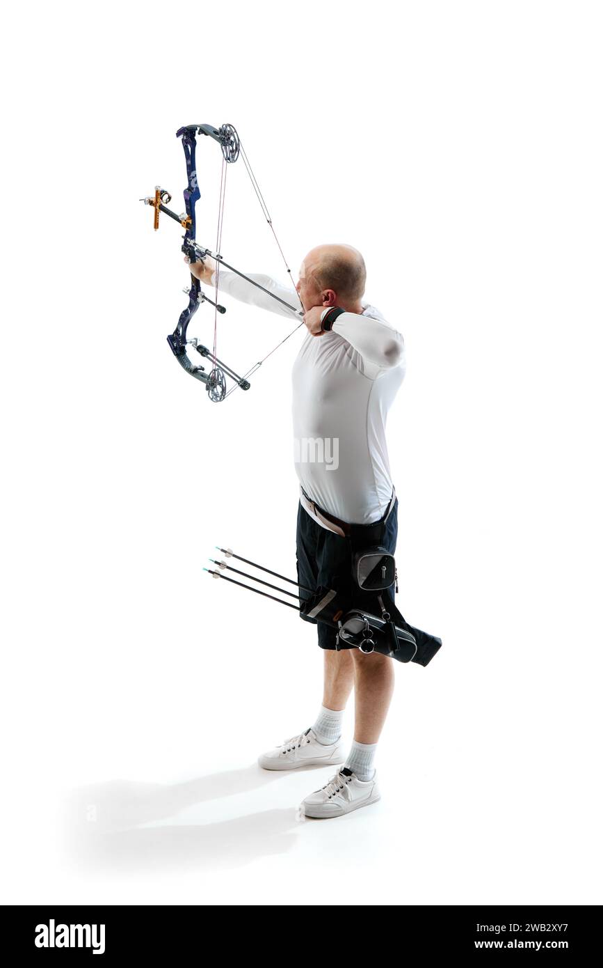 Full-length image of man, artery training, aiming archer bow isolated ...