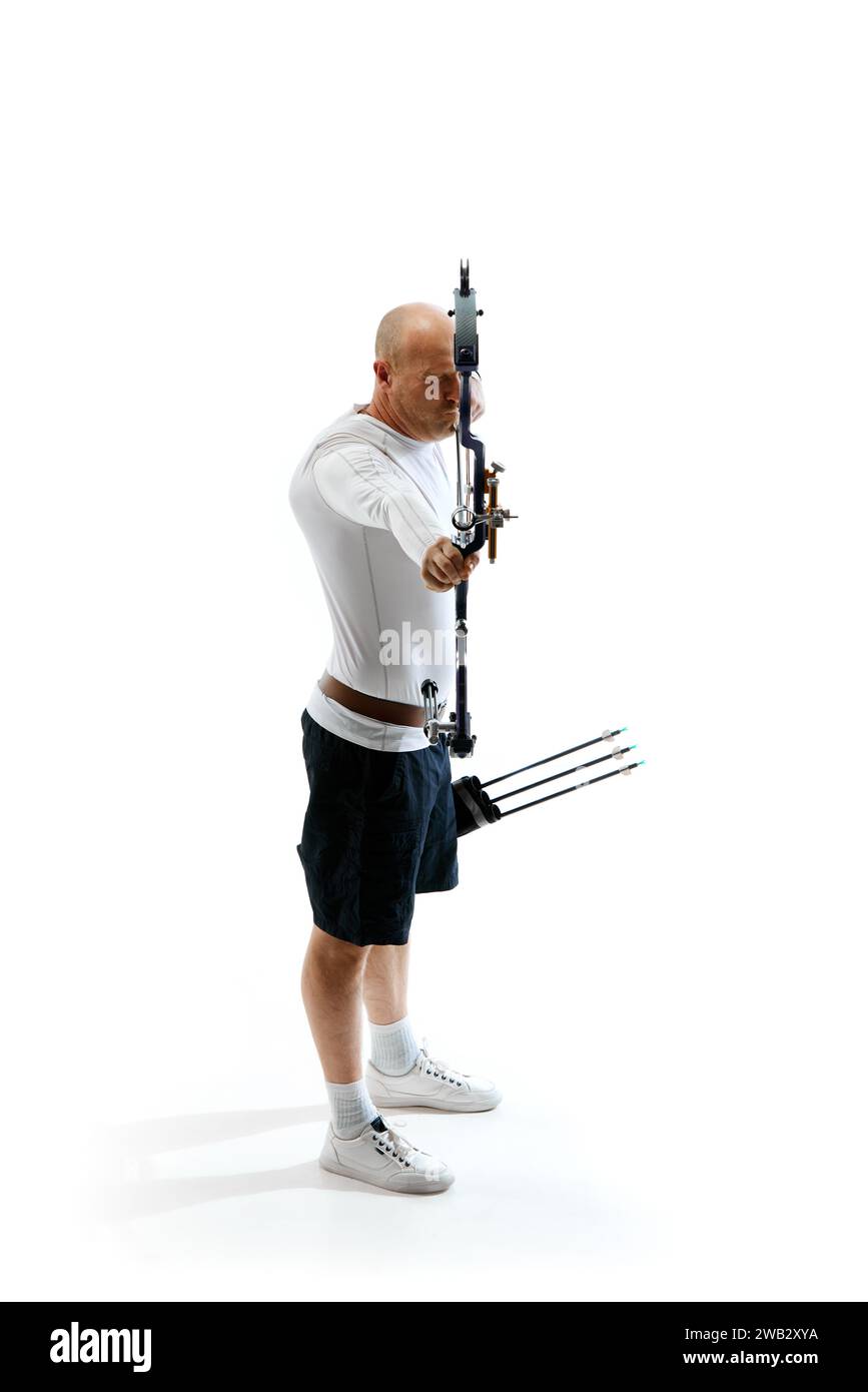 Full-length image of man, artery training, aiming archer bow isolated ...