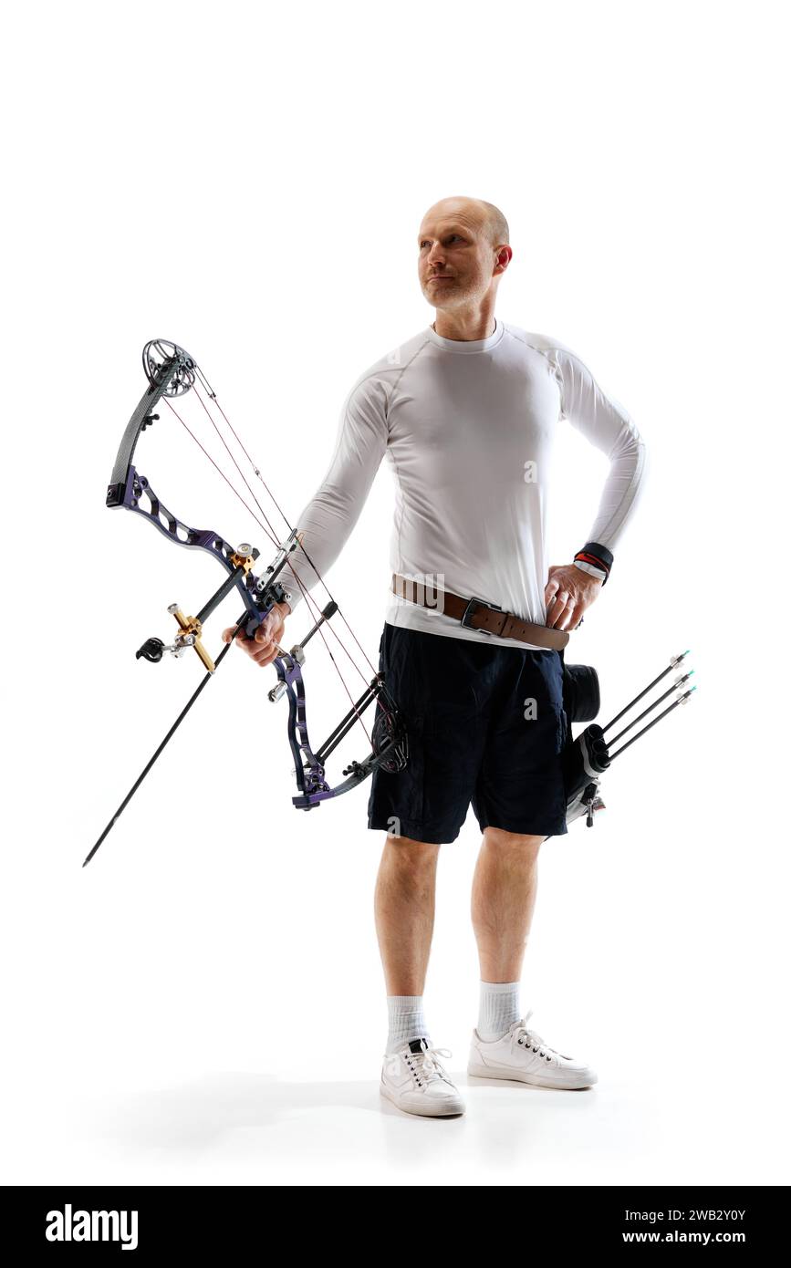 Full-length image of man, archer standing with archery bow and arrows ...