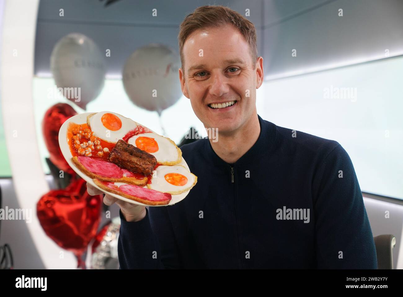 Radio presenter Dan Walker is given a celebratory cake in the shape of ...