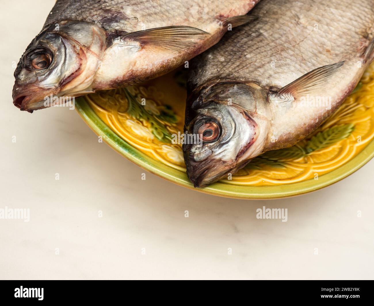 The Dried Fish on a color background Stock Photo - Alamy
