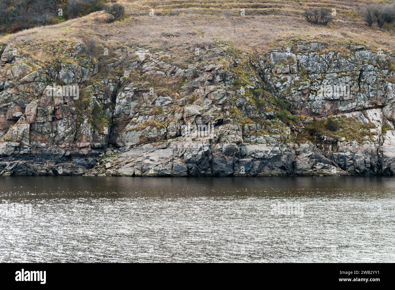 View of the opposite high steep rocky bank of the river. Background ...