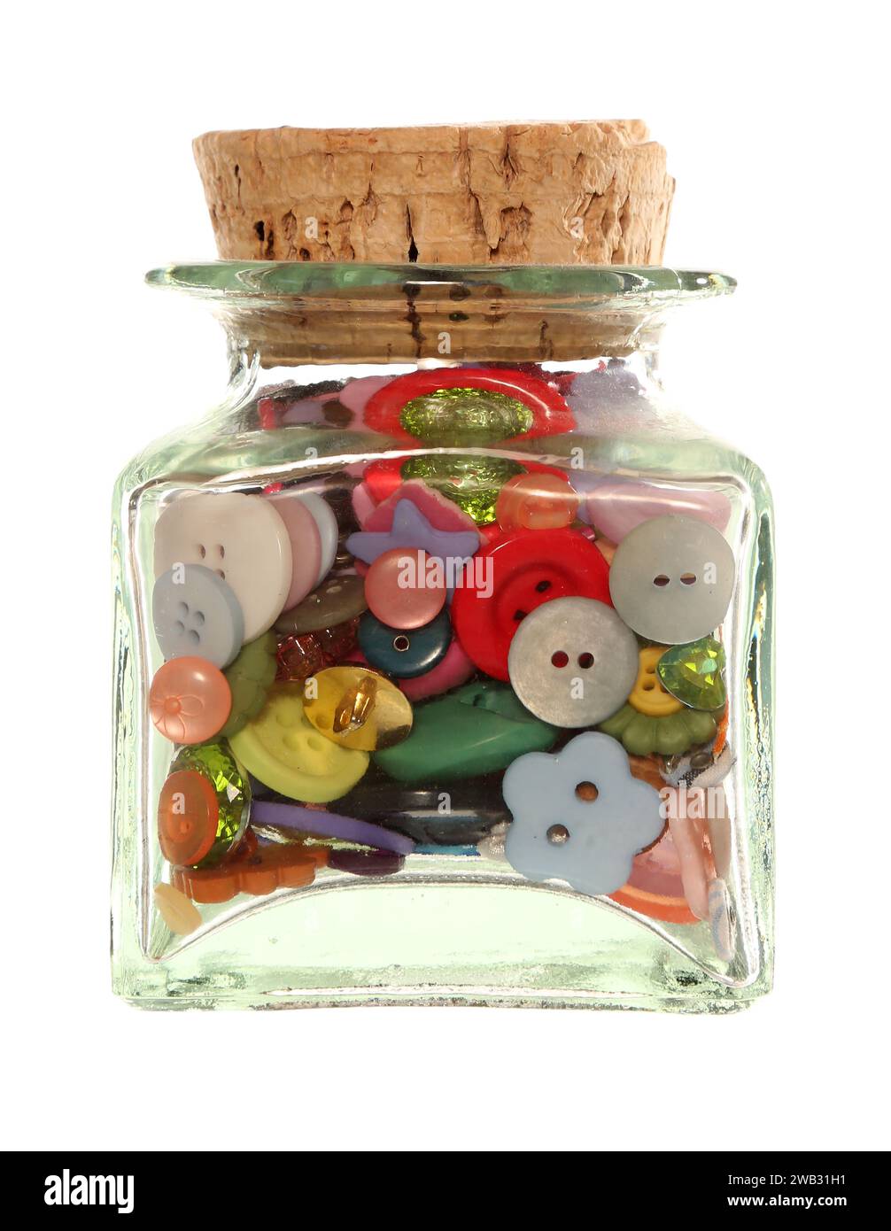 Glass jar with mixture of buttons for sewing isolated on a white ...