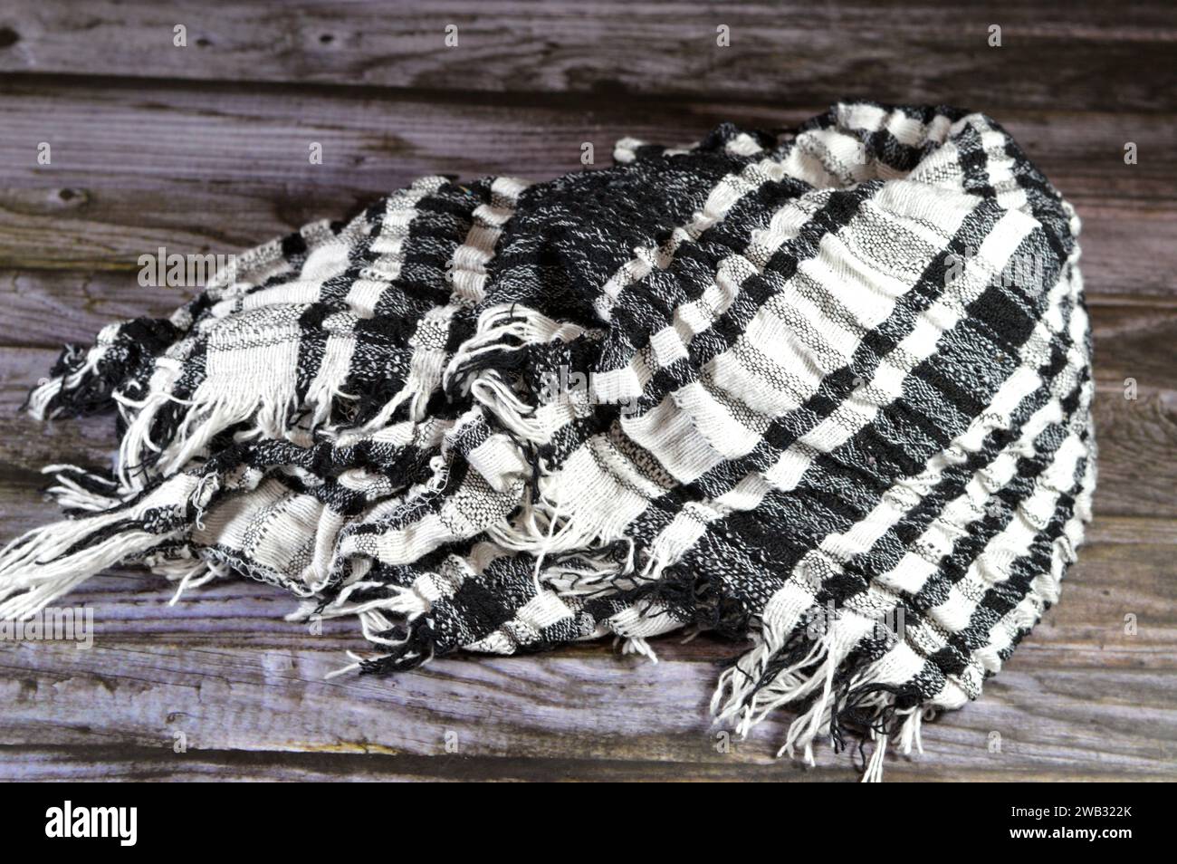 The Palestinian keffiyeh, a distinctly patterned black and white scarf ...