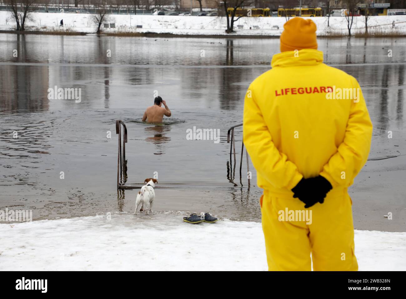KYIV, UKRAINE - JANUARY 6, 2024 - A lifeguard watches over people ...