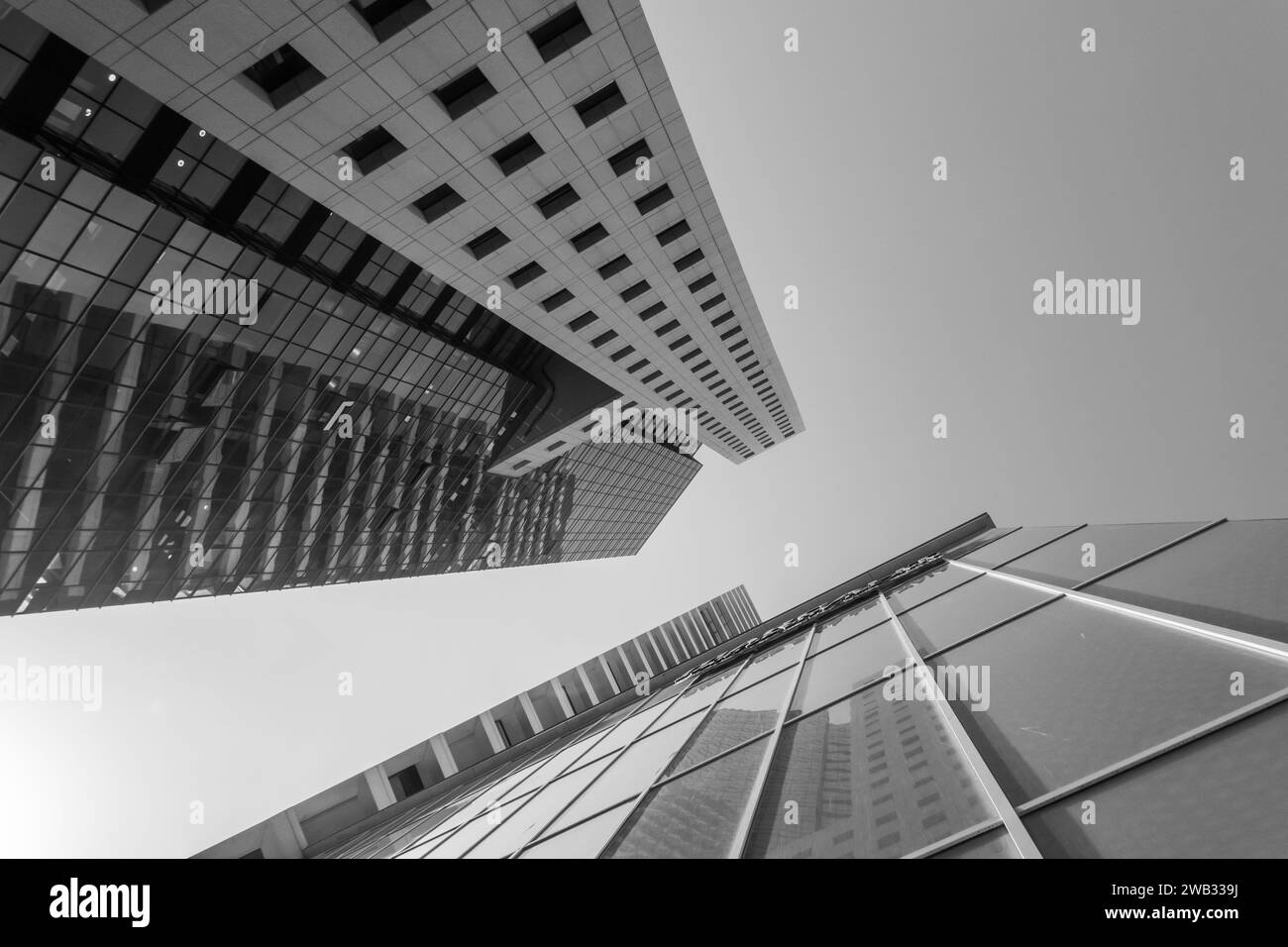 Urban canyon: Perspective view of towering skyscrapers against sky ...