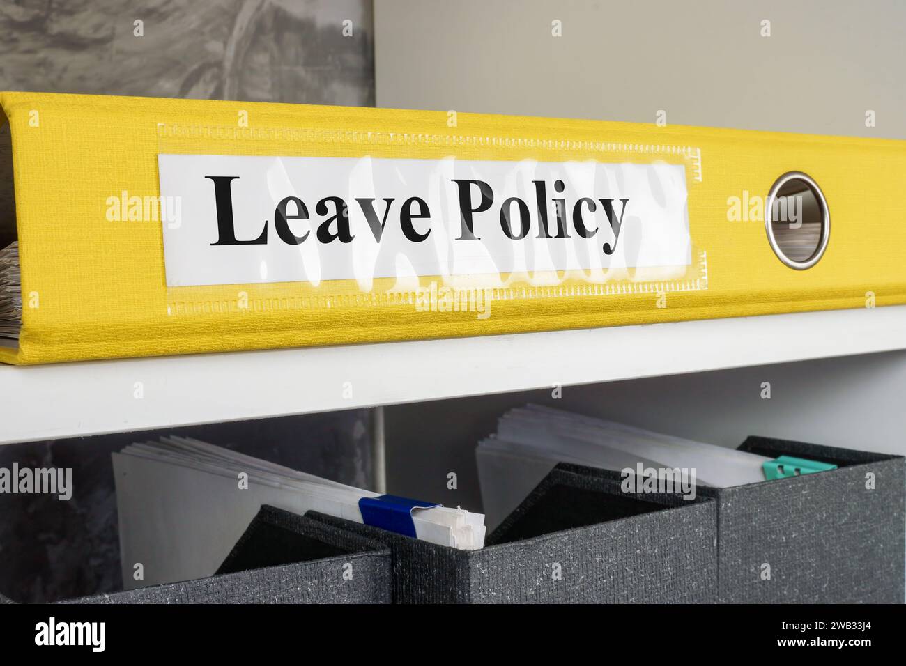 The folder Leave policy lies on the office shelf Stock Photo - Alamy