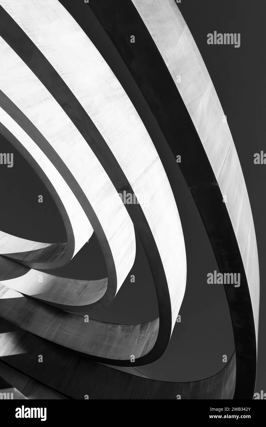 Striking monochrome architectural feature with sweeping curves and a ...