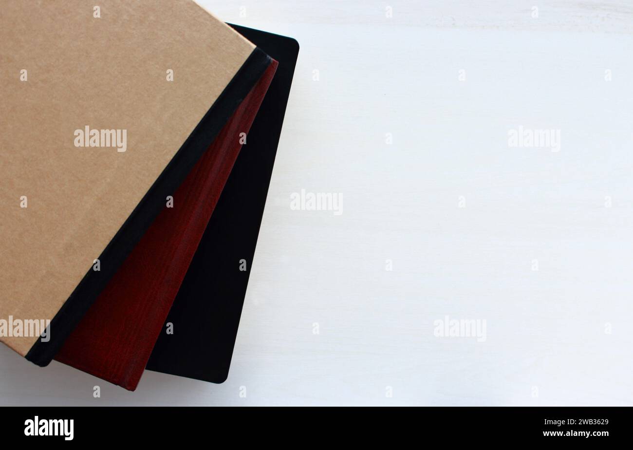 Pile of notebooks on white background with copy space. Office and ...