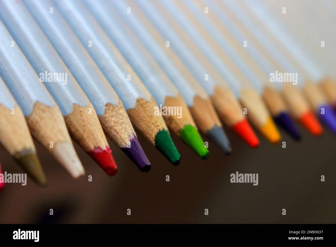 Colourful pencils in a row. Bright pencils on black background. Drawing ... Colourful pencils in a row. Bright pencils on black background. Drawing ...