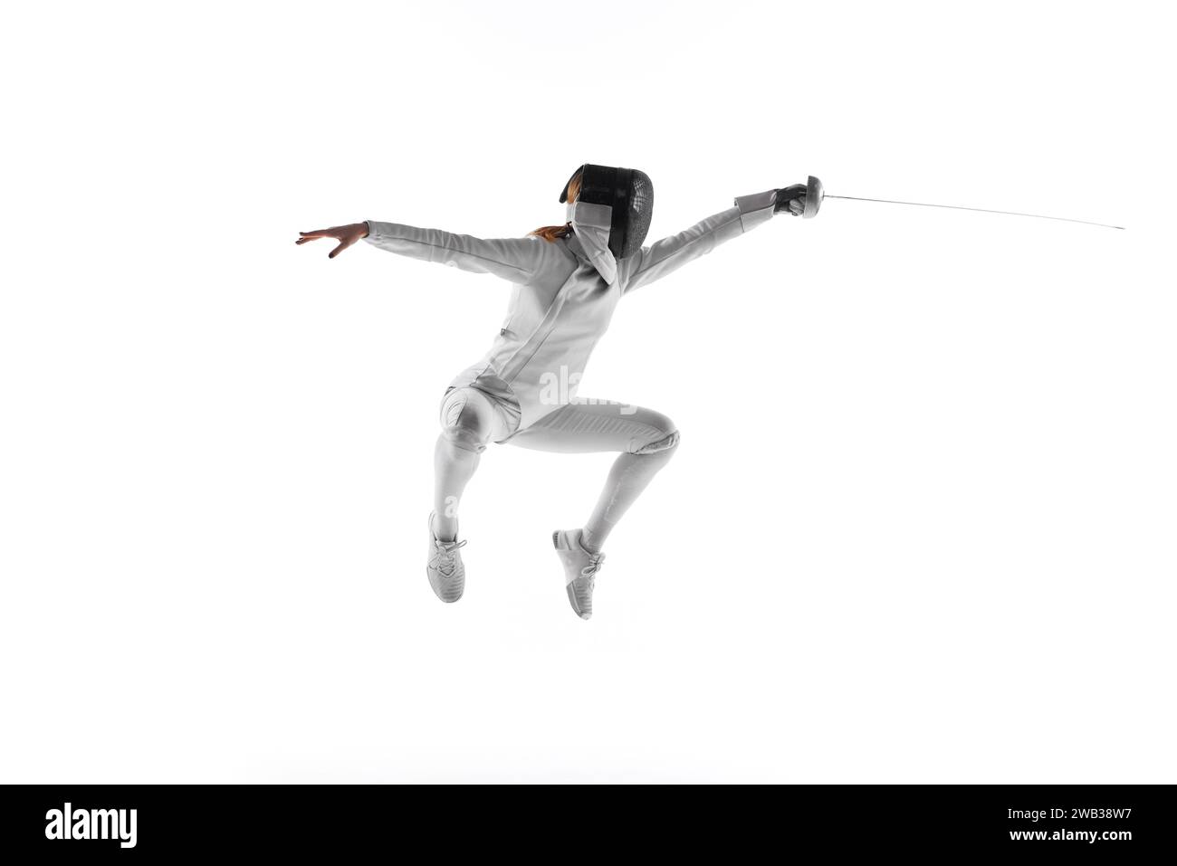 Dynamic mid-air snapshot of swift motion of female fencer's blade ...
