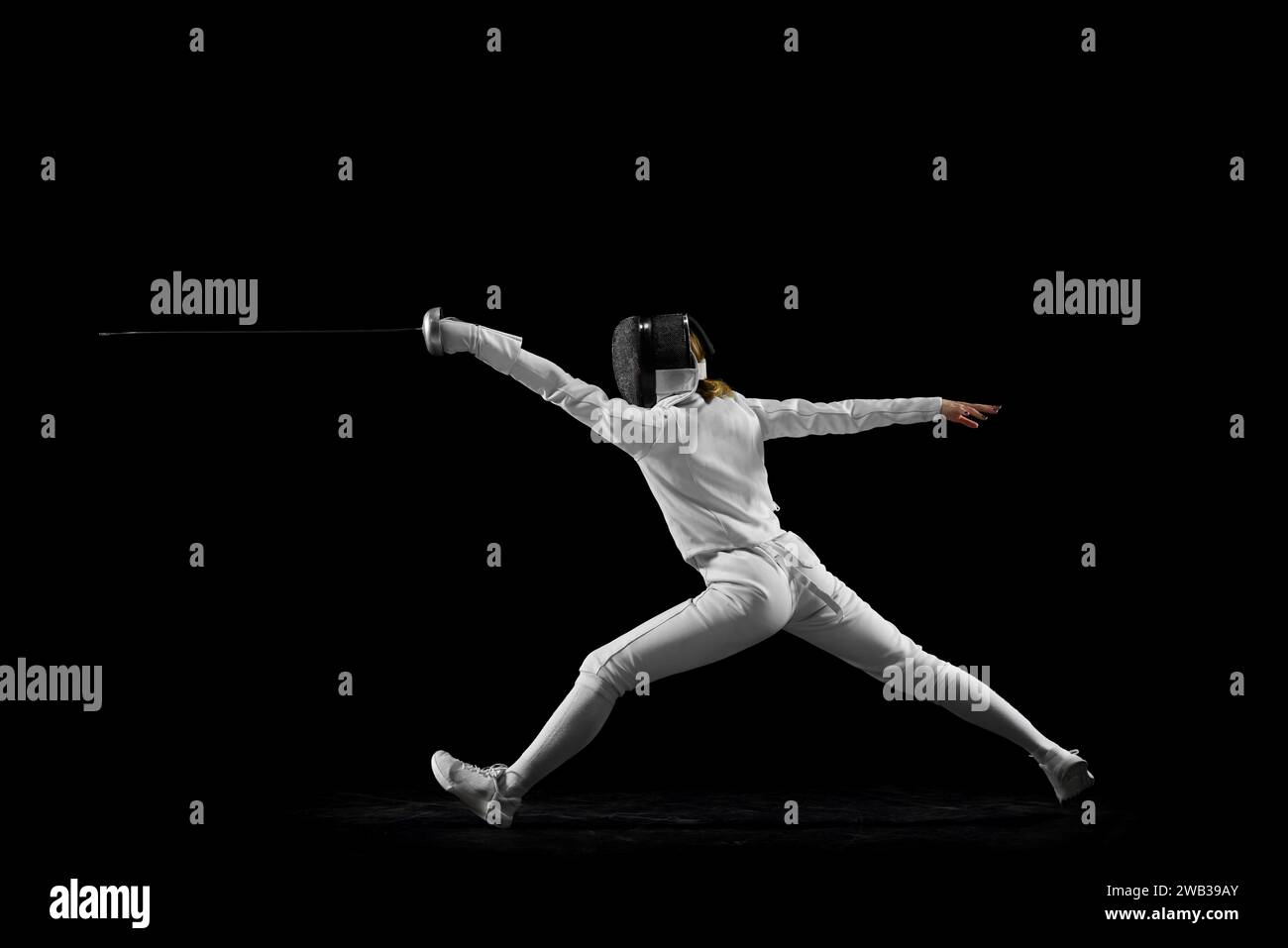 against black studio background Stock Photo - Alamy