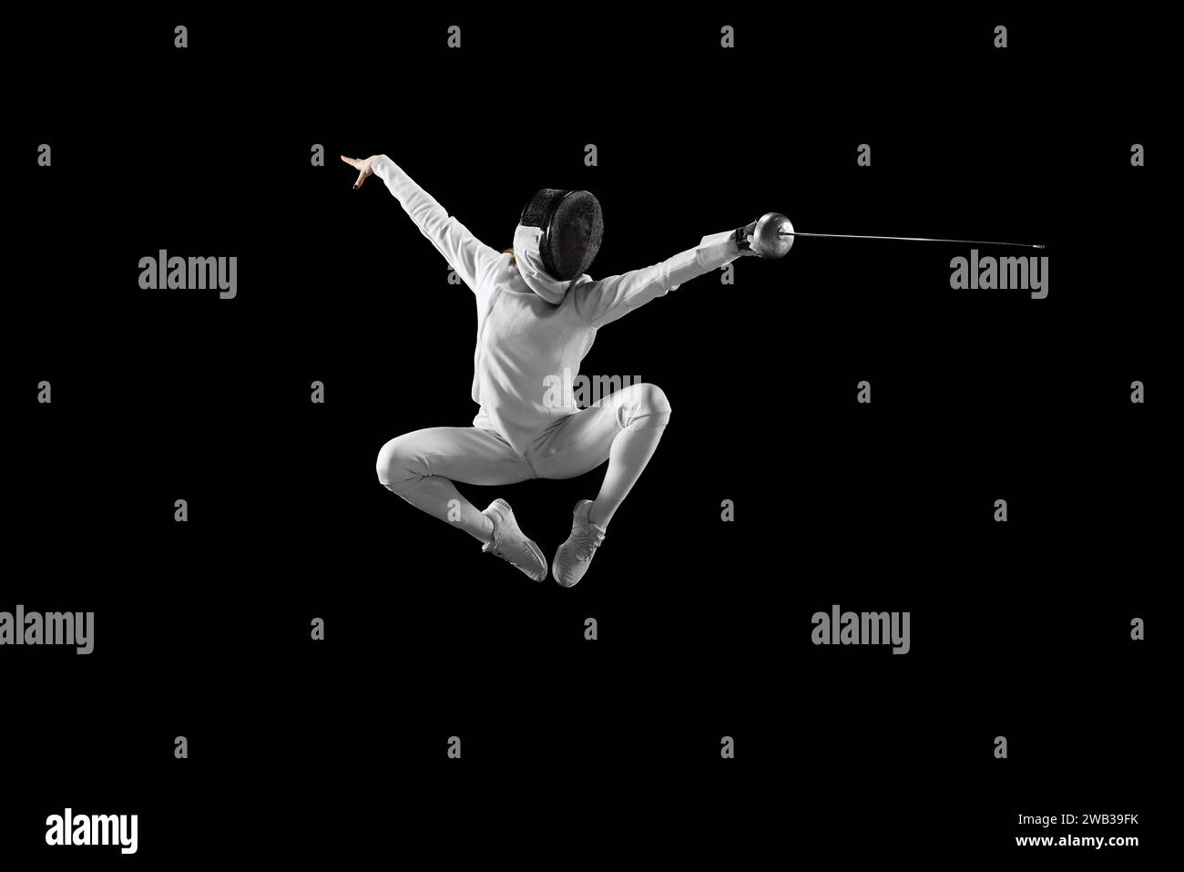 Dynamic mid-air snapshot of swift motion of female fencer's blade ...