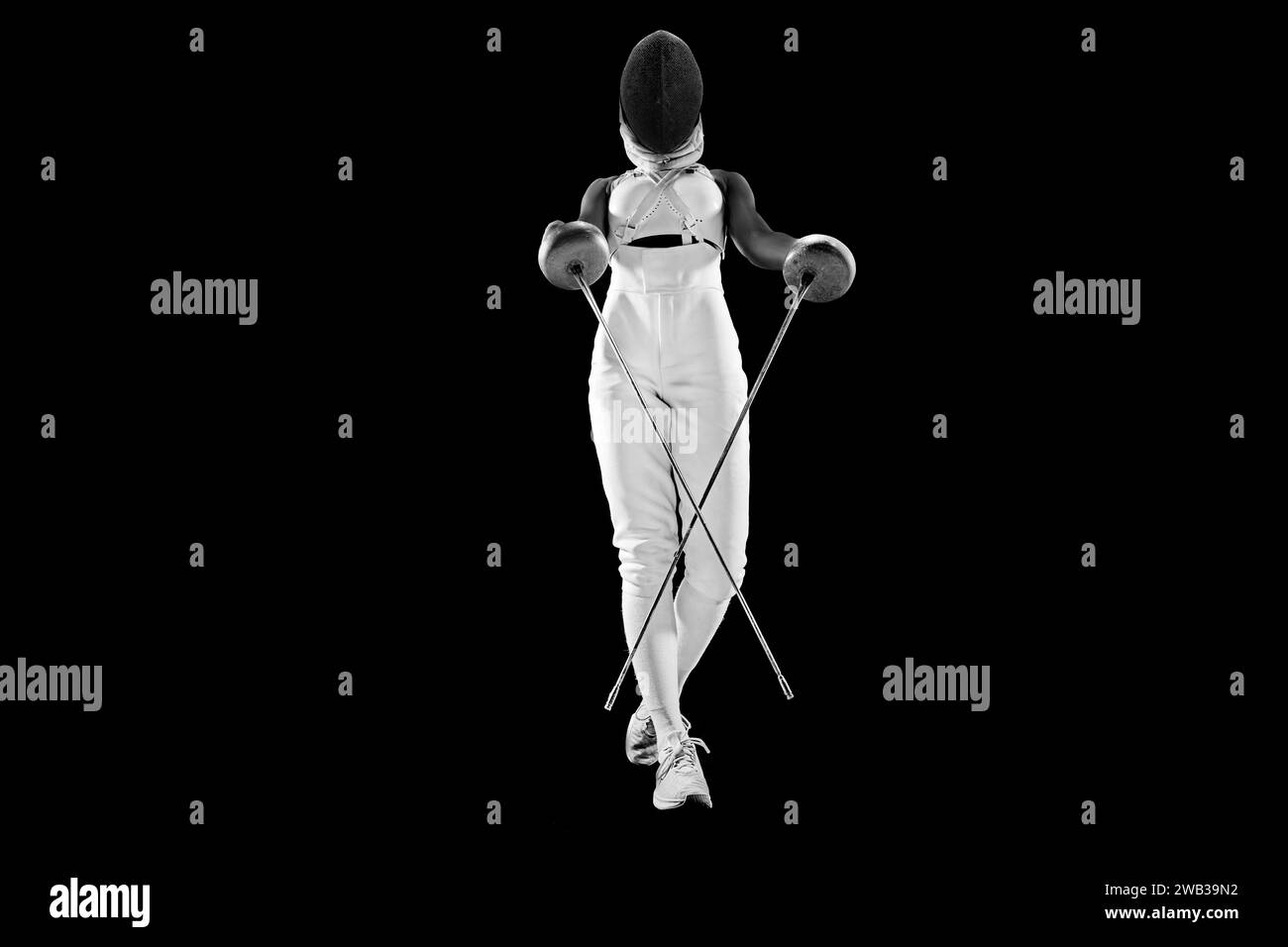 Fierce female fencer, gracefully wielding swords in dynamic pose ...