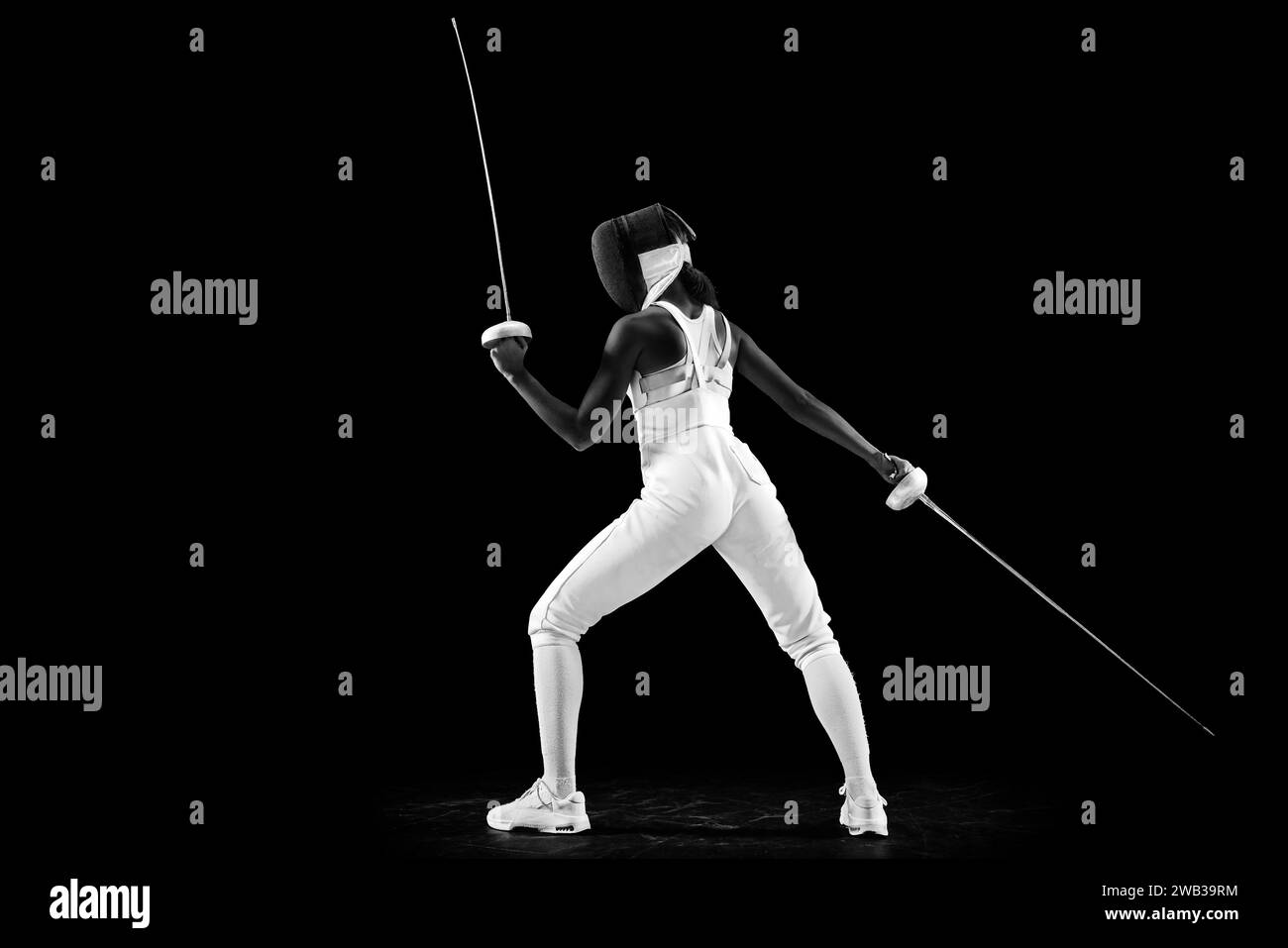 Striking profile of two-sword-wielding sportswoman, radiating power and ...