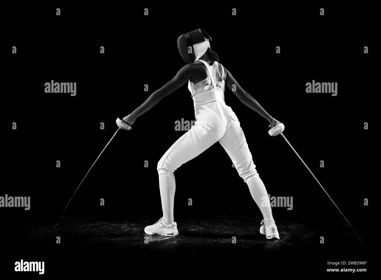 Dual-blade mastery portrait of female fencing maestro, confidently ...