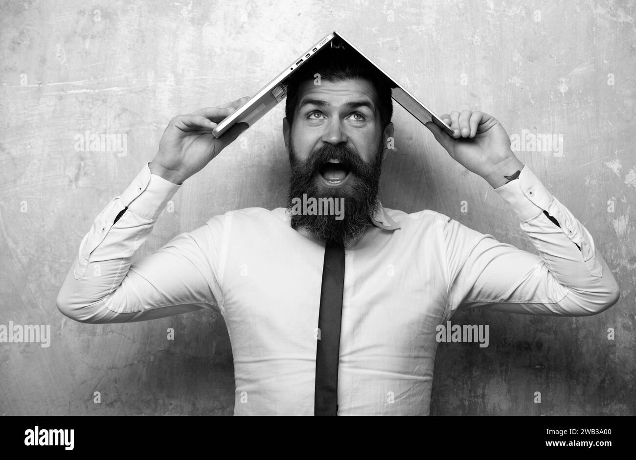 Crazy business man, excited emotions. Exhausted young man hold head ...