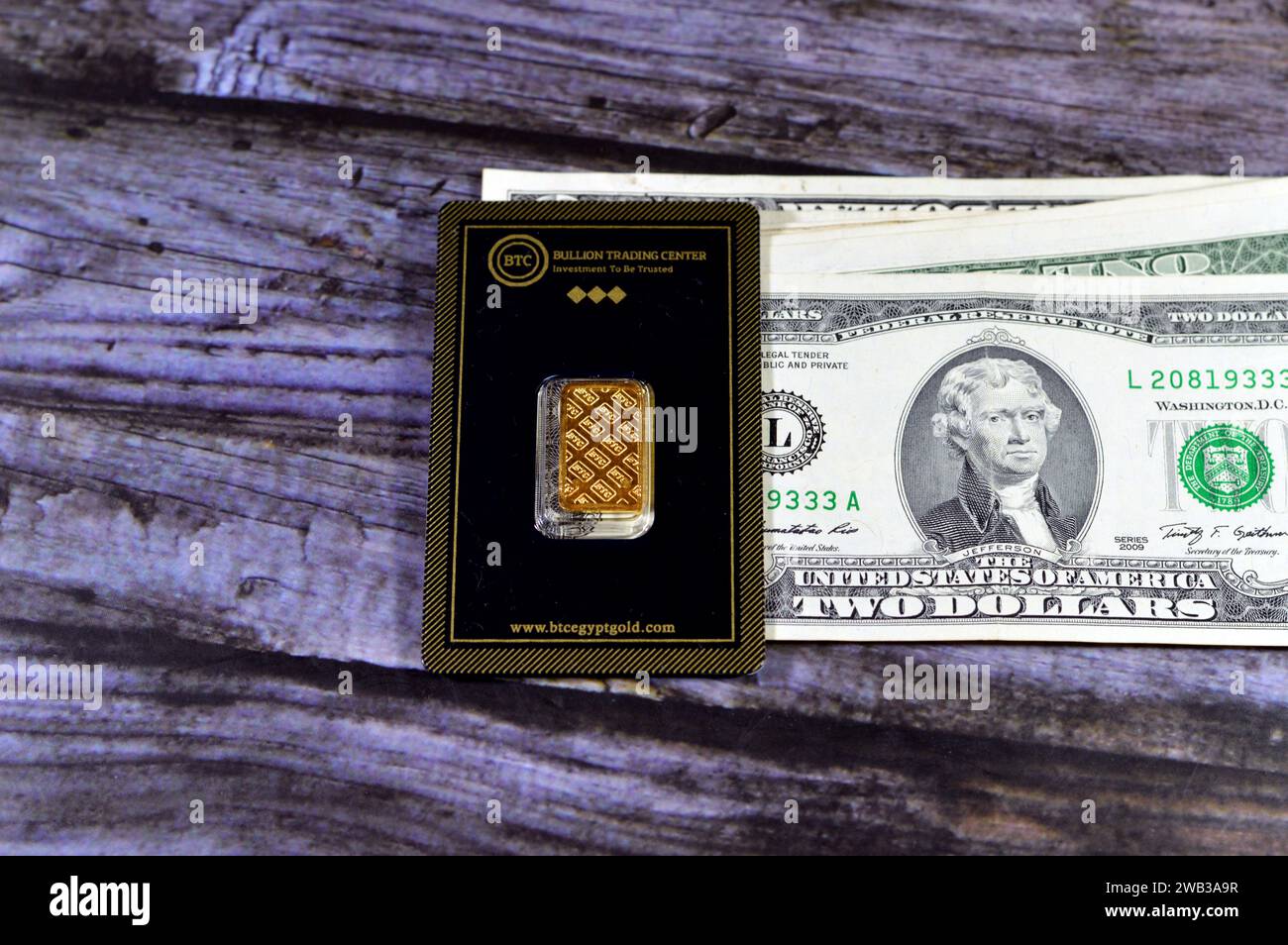 Cairo, Egypt, January 6 2023: American dollars and 24K karat BTC ...