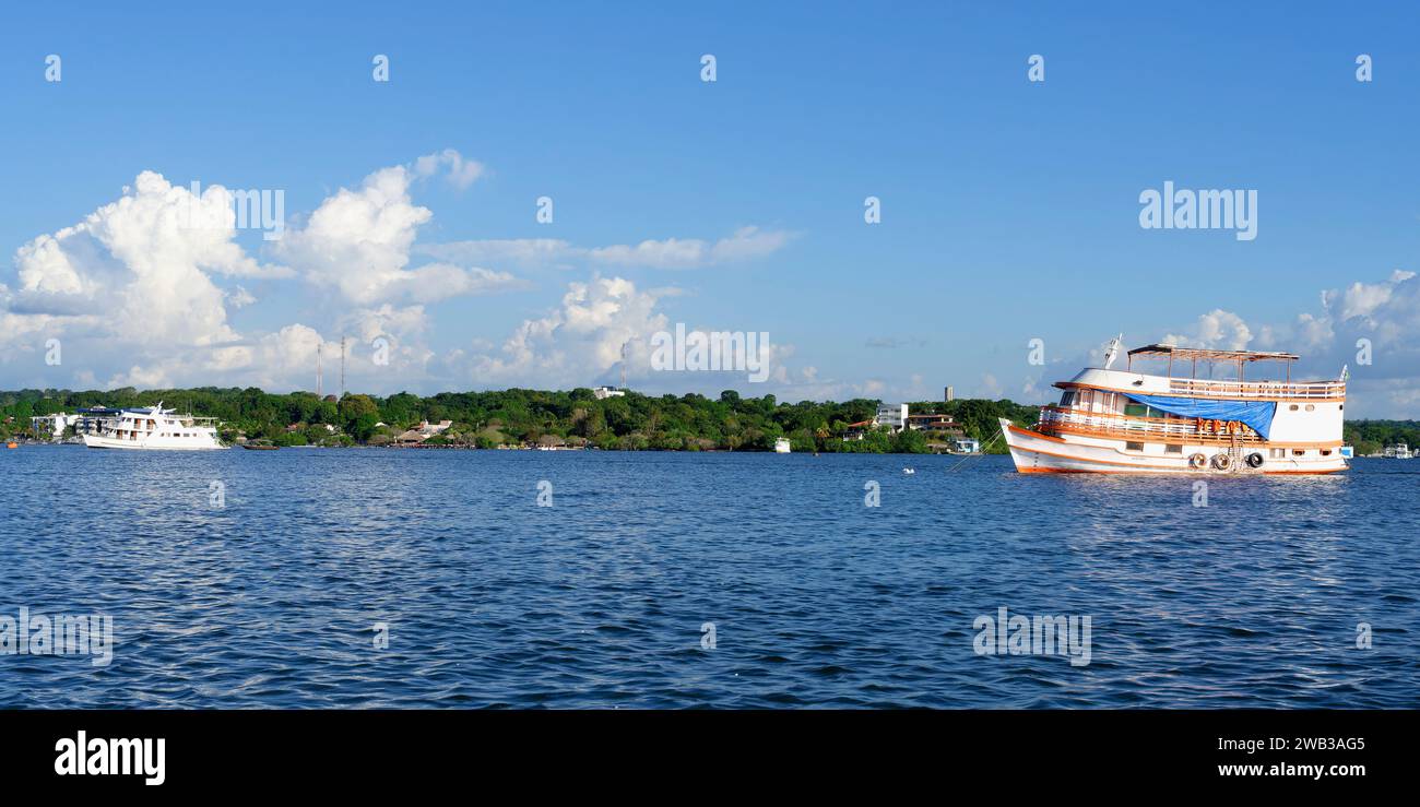 Traditional wooden boat navigating on the Tapajos River, Para state ... Traditional wooden boat navigating on the Tapajos River, Para state ...