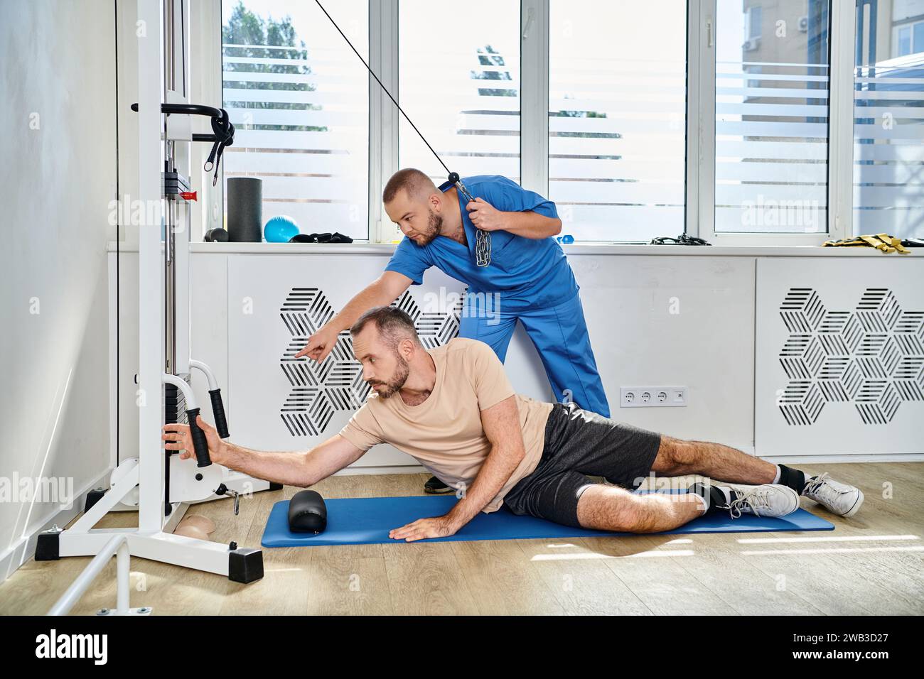 Young recovery expert assisting hi-res stock photography and images - Alamy