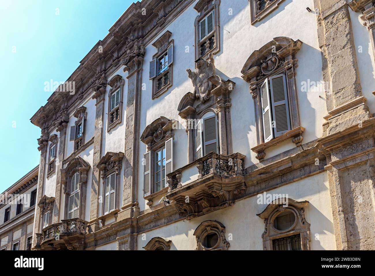 Antique apartment building with stucco and balconies in Milan, Italy ...