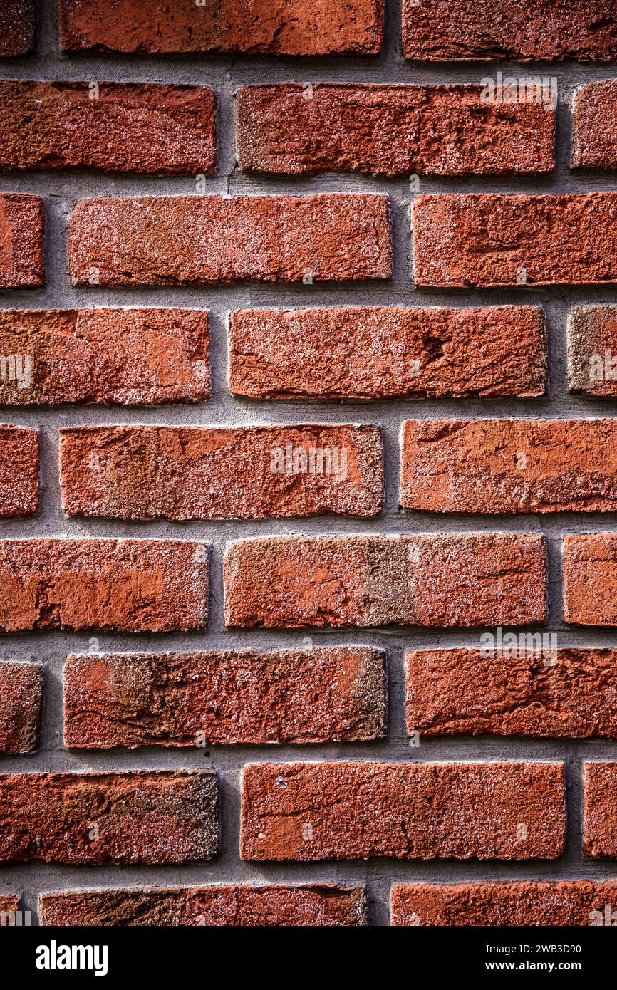 Red brick embossed wall background vertical Stock Photo - Alamy