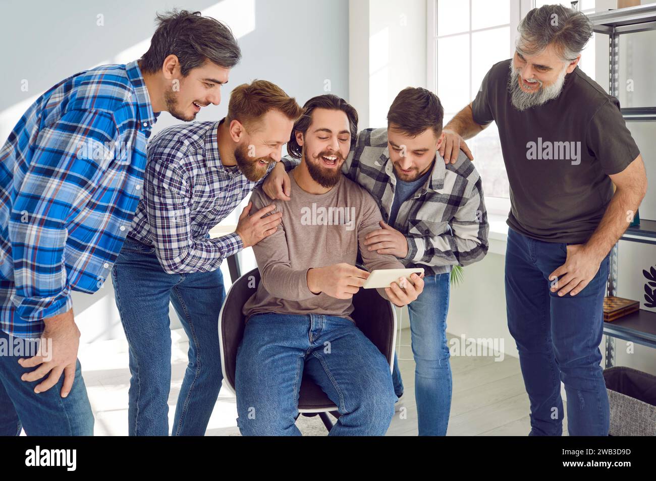 Happy friends watching photos on hi-res stock photography and images ...