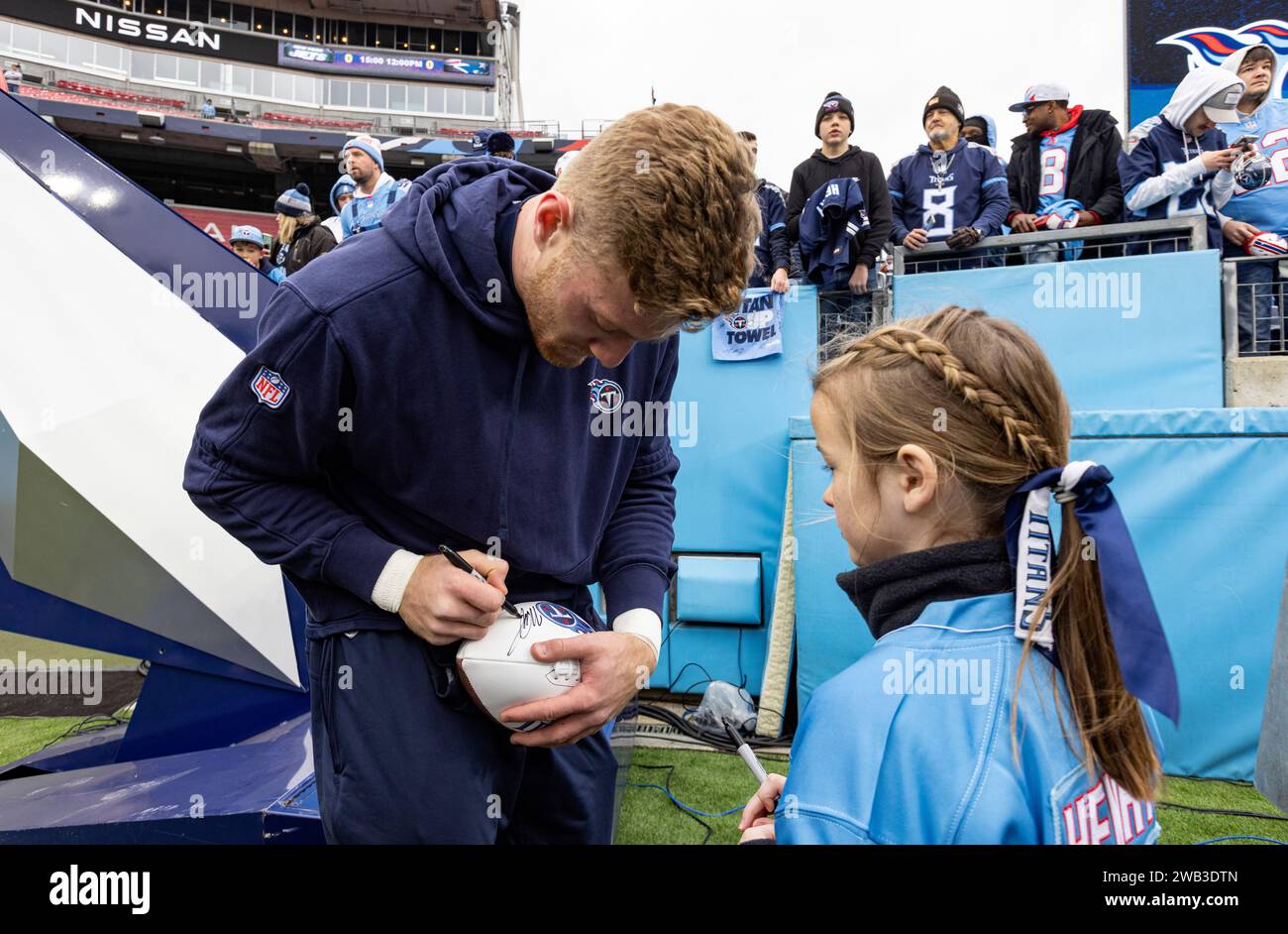 Tennessee Titans quarterback Will Levis (8) signs a football for a ...