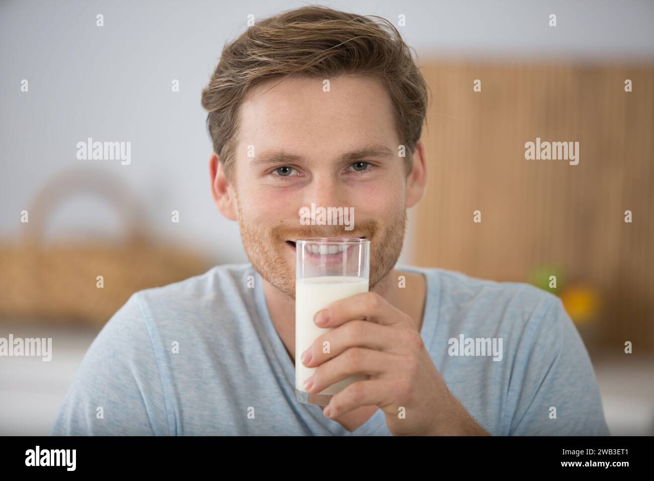 handsome smiling vietnamese man with glass of milk Stock Photo - Alamy