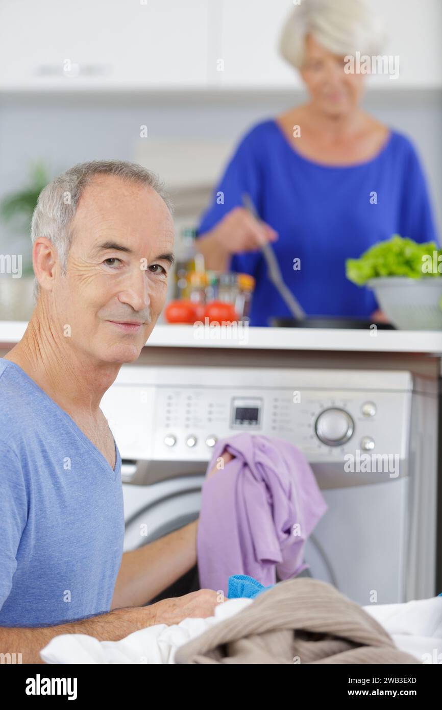 Elderly person doing laundry hi-res stock photography and images - Alamy