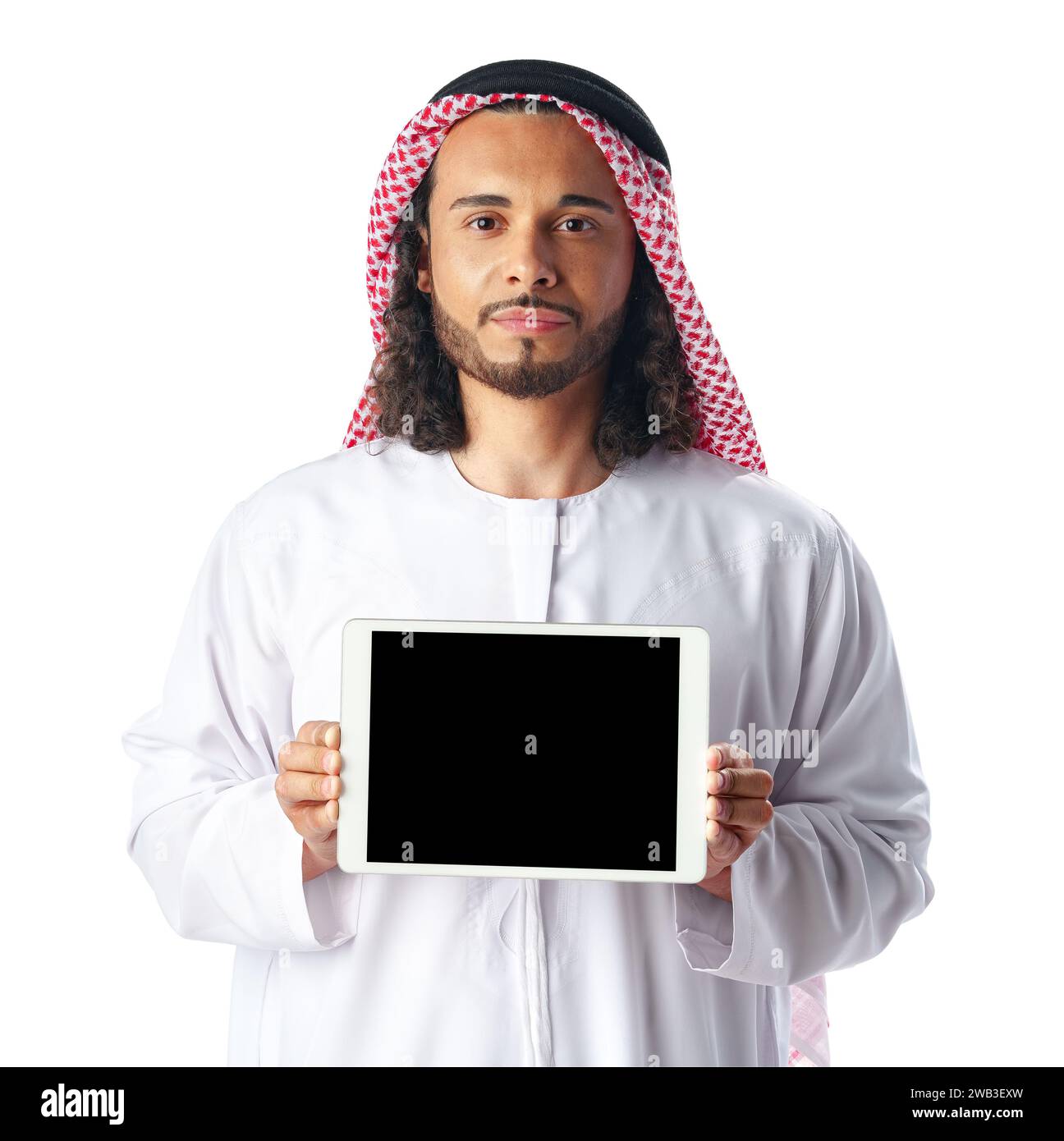 Young Arab man in traditional dress thobe showing digital tablet with ...