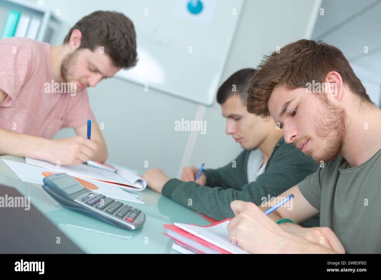 Studious young men hi-res stock photography and images - Alamy