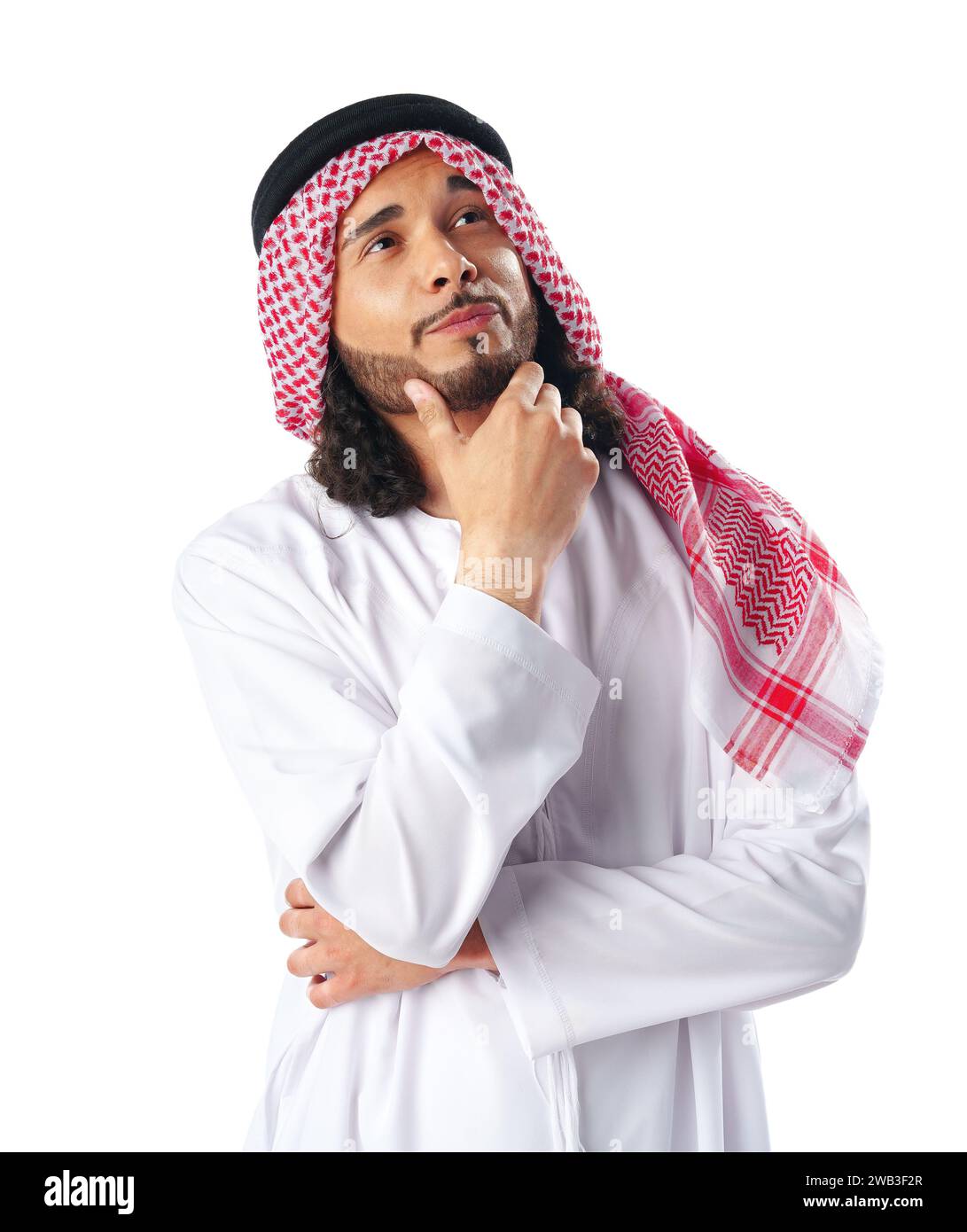 Pensive young man in traditional middle-east dress thobe on white ...