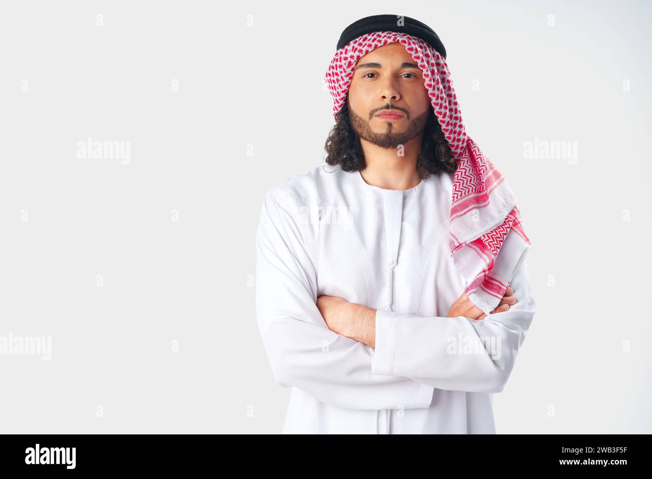 Portrait of a young Arab man wearing middle-eastern traditional dress ...