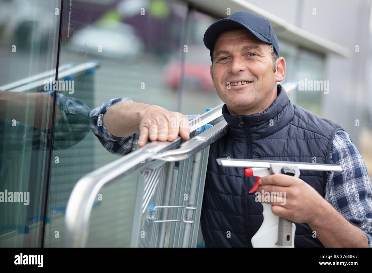 man window cleaner worker with ladder Stock Photo - Alamy